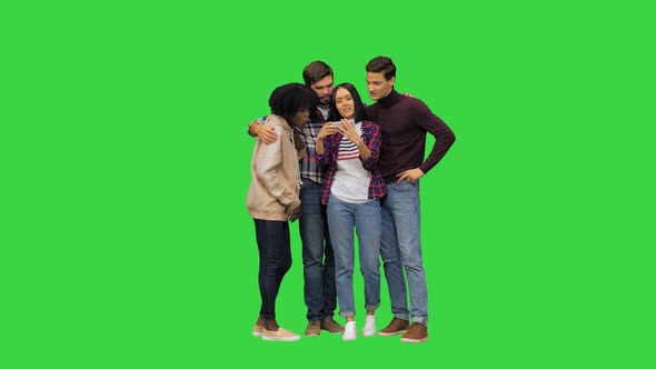 A Group of Friends Checking Out Something Funny on Their Smartphone on ...