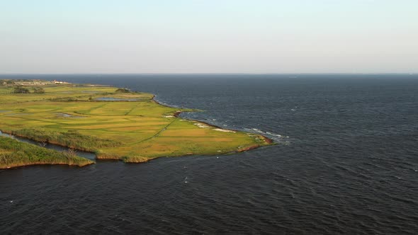 ascending crane shot over the waters at East Islip Marina and Park ...