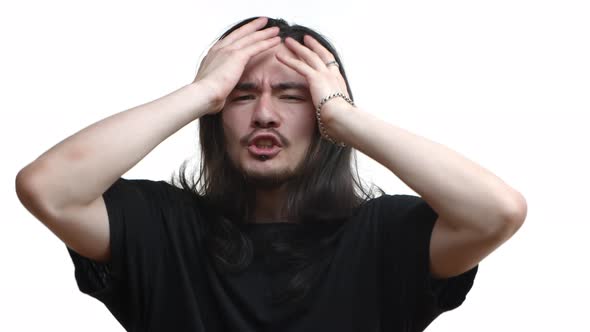 Closeup of Shocked Eastasian Male Rocker Punk Guy with Long Hair and ...