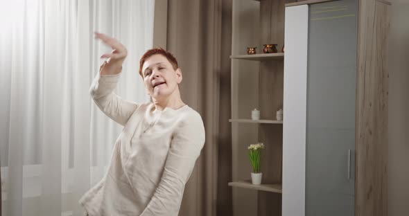 Woman Actively Dancing Sings Jumping for Joy Waving Her Arms Smiling at ...