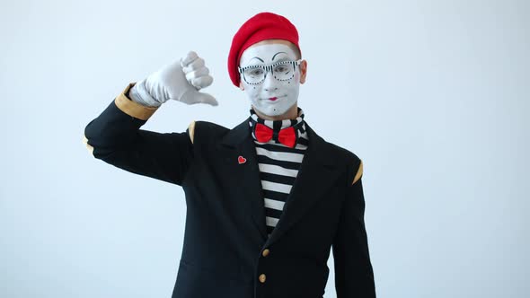Slow Motion of Unhappy Mime Actor Showing Thumbs-down Hand Gesture ...