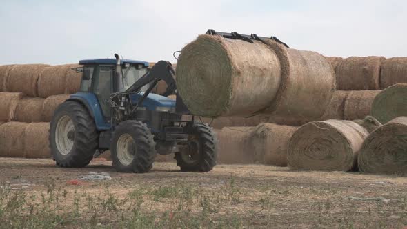 tractor moving bails of hay, Stock Footage | VideoHive