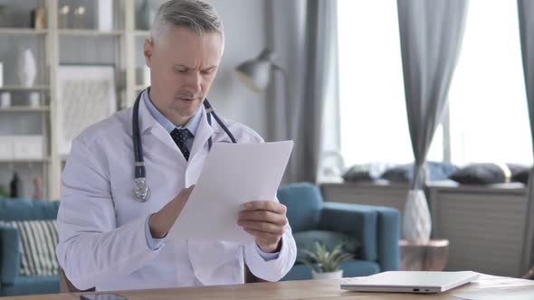 Doctor Reading Medical Report, Stock Footage | VideoHive