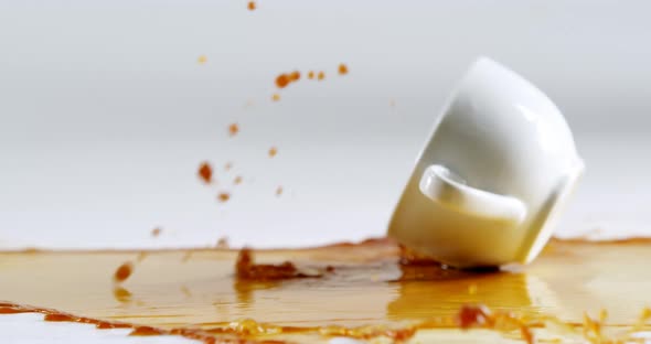 Tea being spilled on white background 4k, Stock Footage | VideoHive