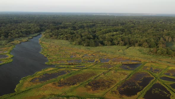 descending crane shot over the waters at East Islip Marina & Park ...
