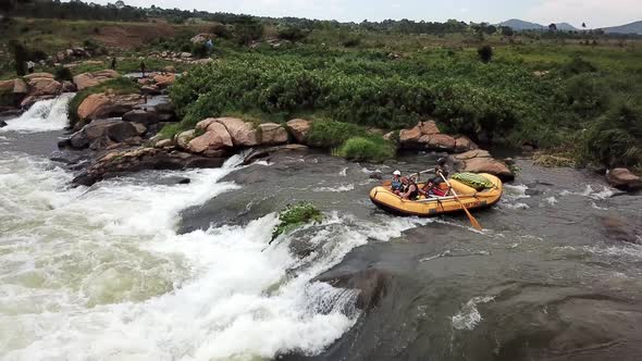 Yellow rafting boat rafting down the Nile River waterfalls, Jinja ...