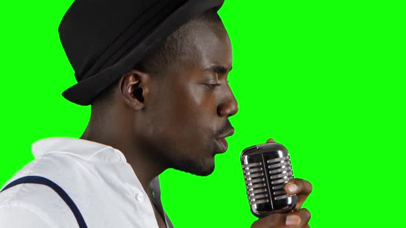 Singer in Half of the Turnover Sings Into a Retro Microphone and ...