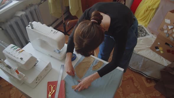 Seamstress Outlining Sewing Pattern on Fabric with Chalk, Stock Footage