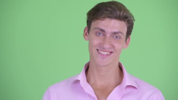 Face of Happy Young Handsome Businessman Nodding Head Yes, Stock Footage