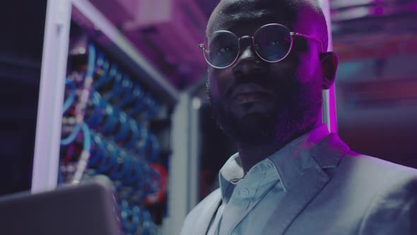 Portrait of African American IT Engineer in Server Room, Stock Footage
