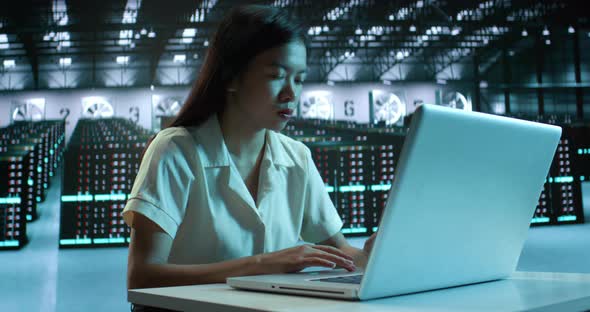 Asian Female IT Technician Using Laptop Doing Maintenance and ...