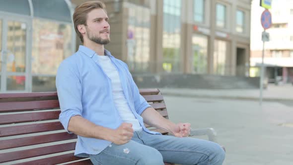 Tense Man Feeling Frustrated While Sitting Outdoor on Bench, Stock Footage