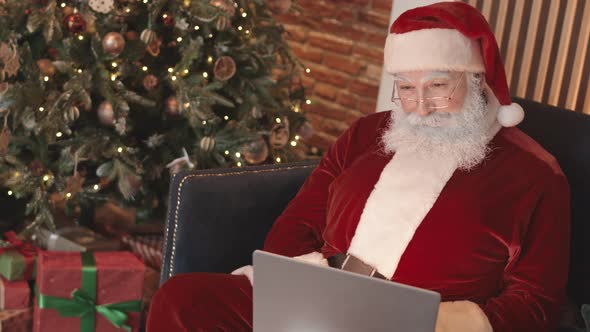 Santa Claus Typing on Laptop Computer, Stock Footage | VideoHive