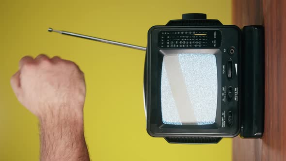 Vertical Video of Knocking on Small Old Television with Grey ...