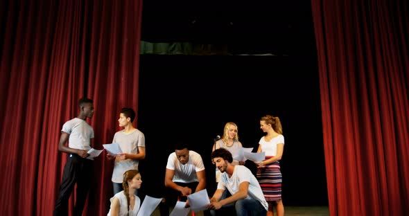 Actors discussing their scripts on stage, Stock Footage | VideoHive