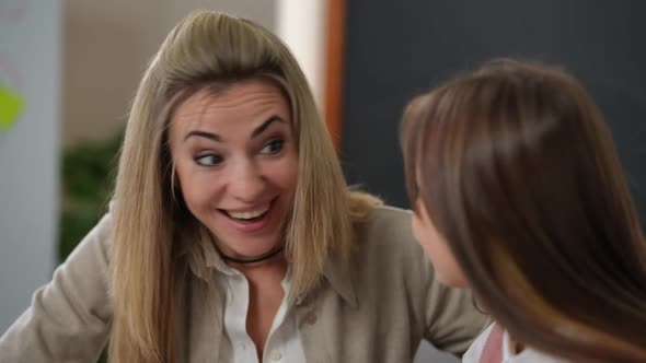 Rack Focus From Absorbed Teacher to Excited Student Rejoicing Hugging ...