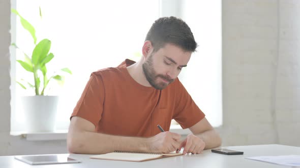 Young Man Writing Letter in Office, Stock Footage | VideoHive