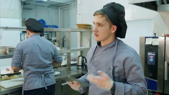 Young Cook Trainee with Tablet Asking Chef Questions About Cooking ...