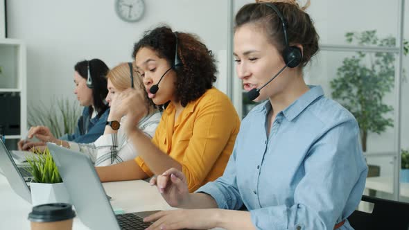 Multiethnic Group of Emplyees Working in Call Center Talking To ...