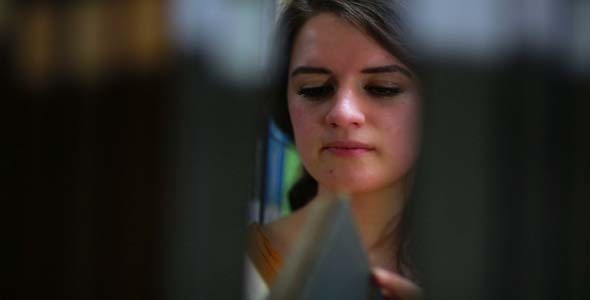Female Student Wandering Between Shelves, Stock Footage | VideoHive