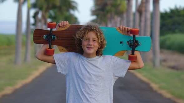 Portrait Boy with a Longboard on a Beautiful Road, Stock Footage ...