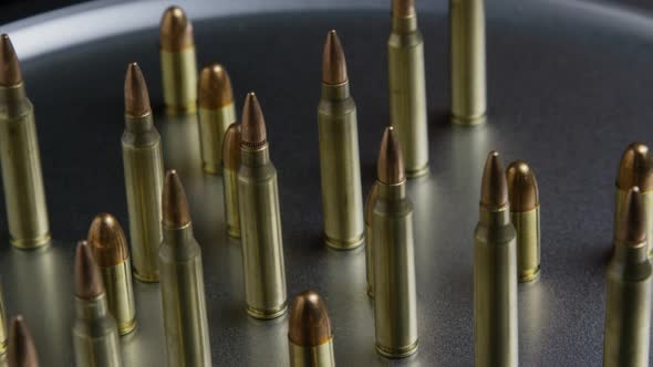 Cinematic rotating shot of bullets on a metallic surface - BULLETS 068 ...