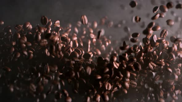 Super Slow Motion Shot of Exploding Premium Coffee Beans and Smoke ...