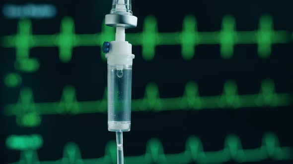 Iv Drip on the Background of Monitoring ECG, Stock Footage | VideoHive