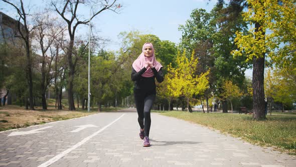 Young Fitness Muslim Woman Doing Sport Excercises Before Run in Park ...