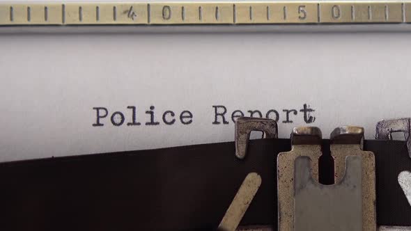 Typing phrase Police Report on retro typewriter. Close up., Stock Footage
