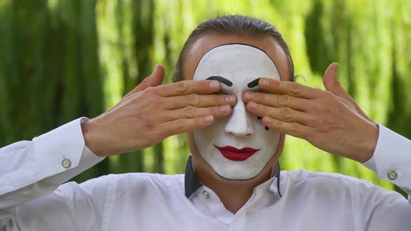 Mime on the Park Shows Pantomime. Mime Closes Her Eyes with Hands ...