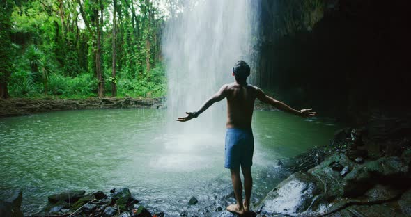 Man Standing Under Waterfall, Stock Footage | VideoHive