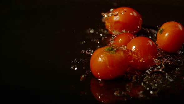 Tomatoes falling and spinning on wet surface, Ultra Slow Motion, Stock ...