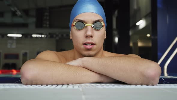 The Tired Swimmer Rests in the Pool, Stock Footage | VideoHive