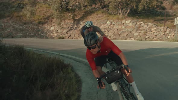 Professional Cyclists Take Sharp Corner of Road, Stock Footage | VideoHive
