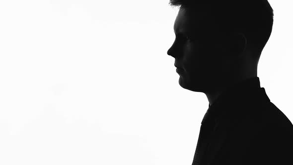 Silhouette of Male Serial Killer Holding Gun, Preparing to Shoot, Crime ...