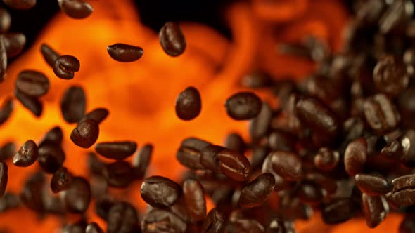 Super Slow Motion Shot of Coffee Beans and Flames After Being Exploded ...