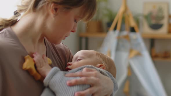 Mom Rocking Baby to Sleep, Stock Footage | VideoHive