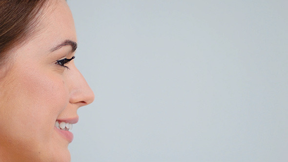 Side View on Beautiful Woman Face Posing Over Gray, Stock Footage ...