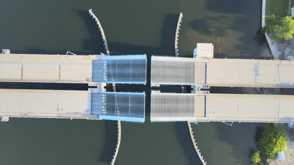 Aerial video of a drawbridge opening up. The drawbridge links a small ...