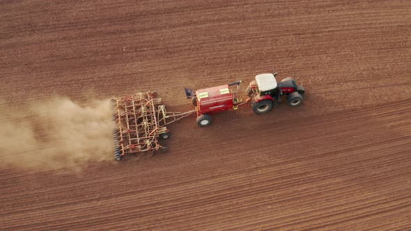Aerial View to Tractor Plowing Field, Stock Footage | VideoHive