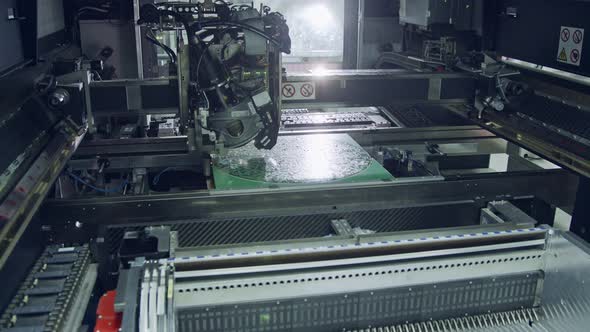 Close up of SMT Machine placing components on a circuit board, Stock ...