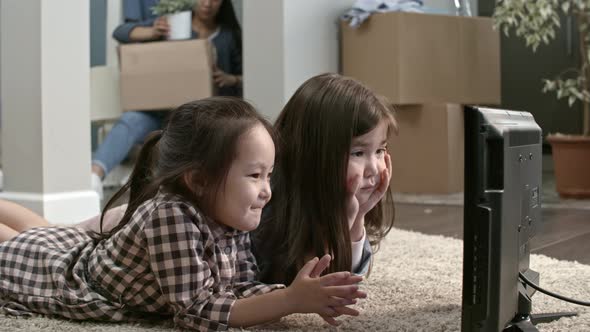 Tired Children Watching TV after Moving House, Stock Footage | VideoHive