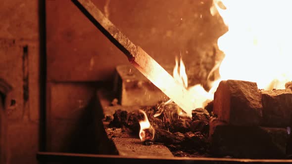 Hot Metal in a Forge. Blacksmith Pulls a Hot Piece of Metal Out of the ...