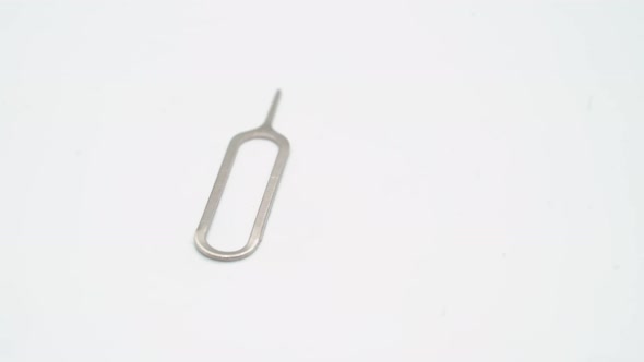 A Paper Clip for Removing a SIM Card in a Mobile Phone, Stock Footage
