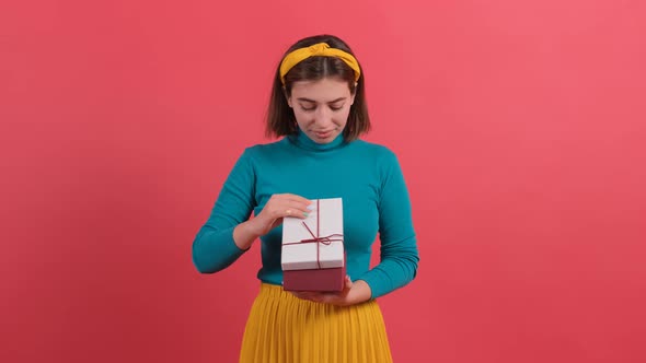 Young Woman Opening Box and Expressing Great Disappointment. by ...