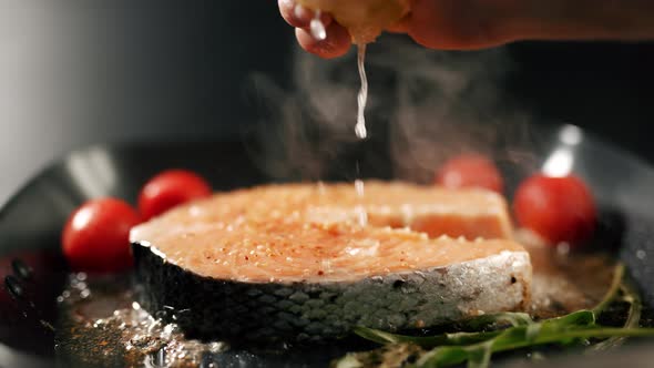 A Chef's Hand is Squeezing a Fresh Lime Over a Peace of Red Sea Fish ...