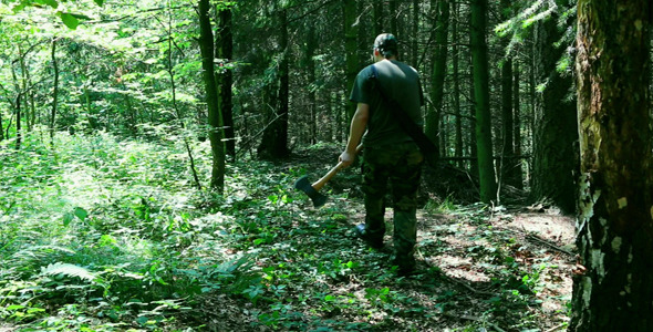 Man With Combat Axe In Forest, Stock Footage | VideoHive