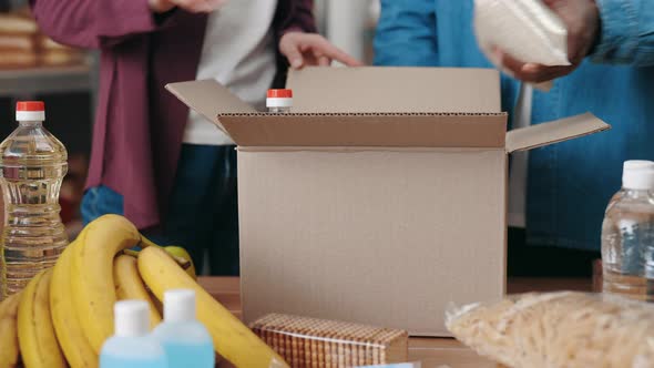 Close Up of People Packing Food in Boxes at Food Warehouse, Stock Footage