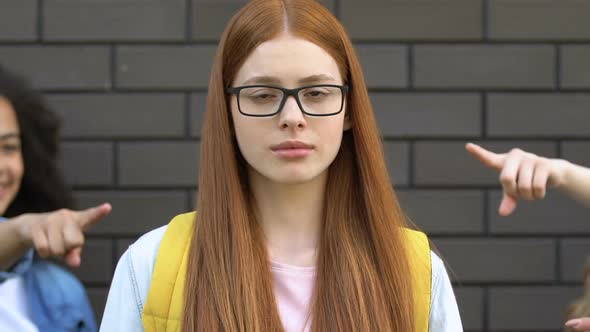 Teenagers Pointing at Red Hair Girl in Glasses, Mocking Nerd, Verbal ...